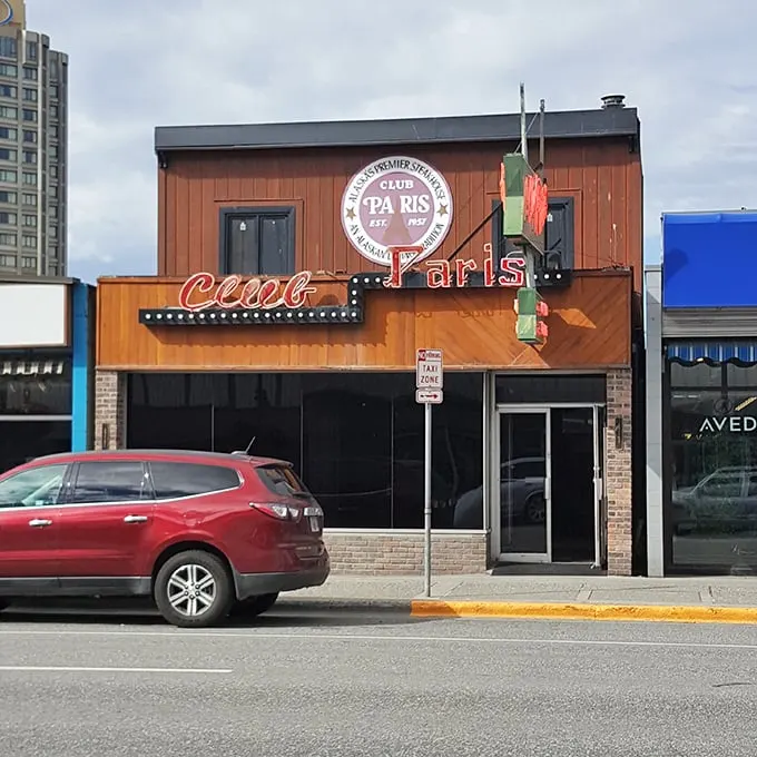 Neon dreams and culinary schemes! Club Paris beckons with its retro sign, promising a night of cocktails, dining, and perhaps a dash of Parisian flair in the heart of Anchorage.