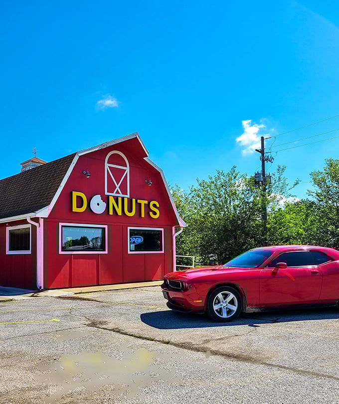 The iconic red barn stands proudly against the Arkansas sky, a beacon of breakfast bliss that practically screams "donuts happen here!"