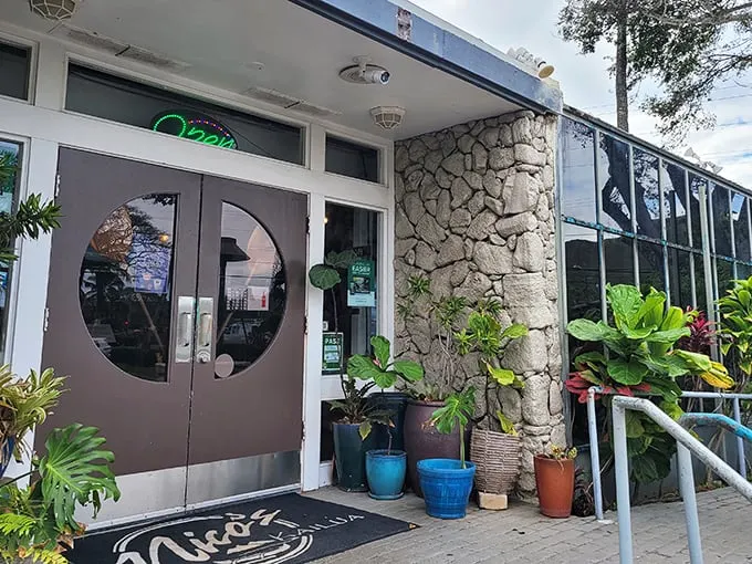 Welcome to flavor paradise! Nico's Kailua's entrance is like a portal to deliciousness, complete with tropical plants and island charm.