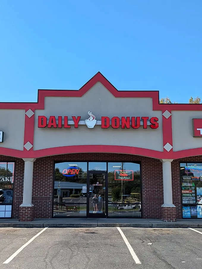 Welcome to donut paradise! Daily Donuts' cheery red sign promises a sugar-coated adventure that'll make your taste buds do a happy dance.
