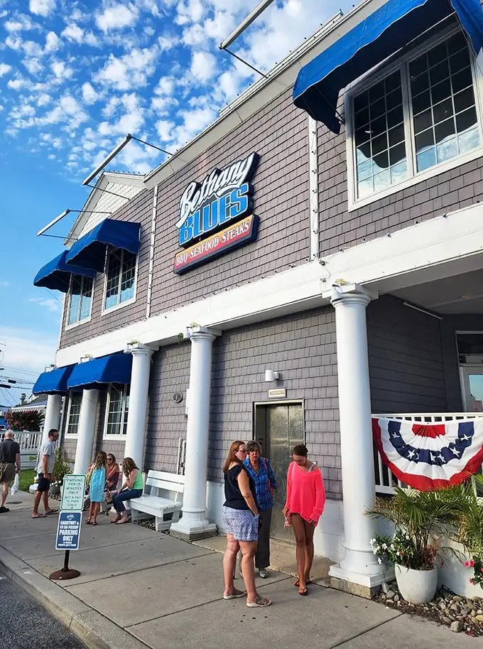 The blue-shingled beacon of BBQ excellence stands proud on Coastal Highway, its classic beach architecture promising smoky delights within these Delaware shores.