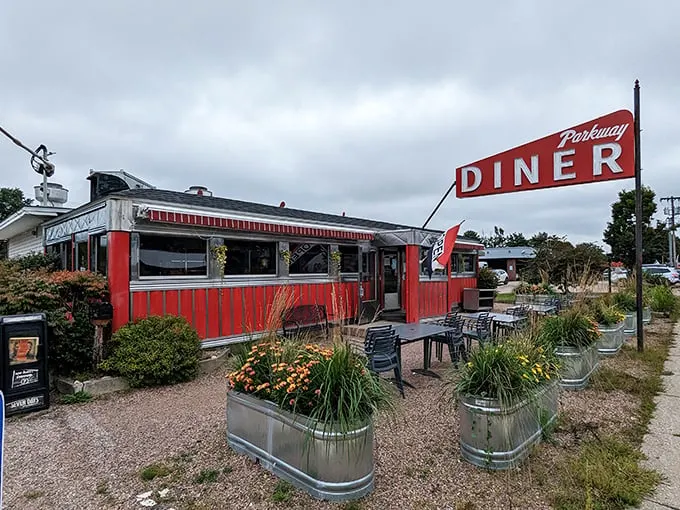 Step into a time machine disguised as a diner! This classic red-and-white exterior promises a journey back to the golden age of comfort food.