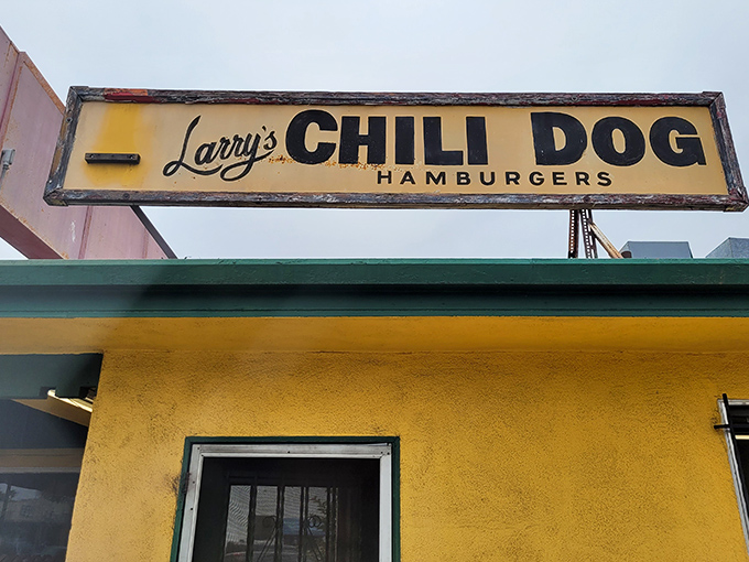A beacon of comfort food! Larry's Chili Dog sign promises a journey back to the golden age of diners and drive-ins.
