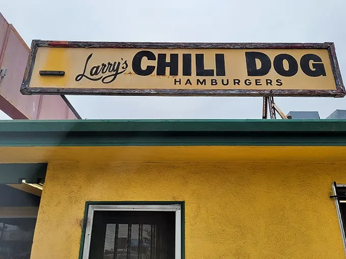 A beacon of comfort food! Larry's Chili Dog sign promises a journey back to the golden age of diners and drive-ins.