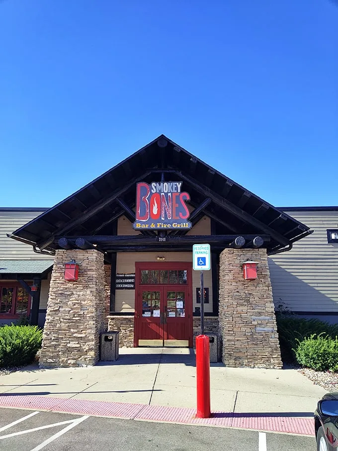A rustic lodge or a barbecue haven? At Smokey Bones, it's deliciously both. This stone-faced facade promises a meaty adventure that'll make your taste buds do a happy dance.