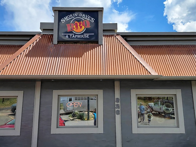The rustic red-roofed exterior of Smokin' Dave's beckons like a barbecue beacon in Estes Park. Happy hour every day? Count me in!