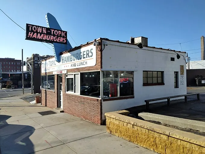 Step back in time! Town Topic's iconic sign beckons like a neon-lit lighthouse, guiding hungry souls to burger nirvana.