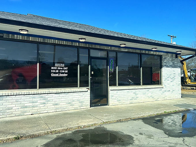 A humble brick facade hides a world of sugary delights. Mark's Do-Nut Shop: where dreams come glazed, frosted, and filled.