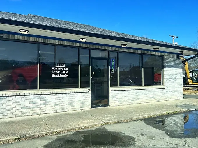 A humble brick facade hides a world of sugary delights. Mark's Do-Nut Shop: where dreams come glazed, frosted, and filled.