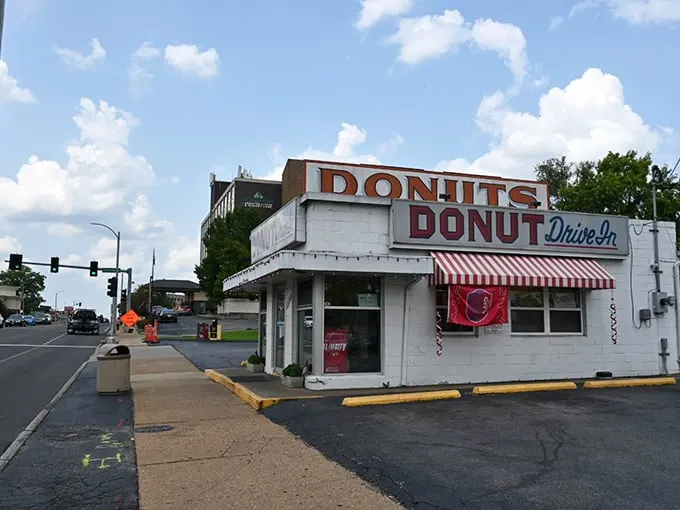 Retro chic meets sugar rush! This vintage neon sign isn't just advertising donuts; it's beckoning you to a time-traveling taste adventure.