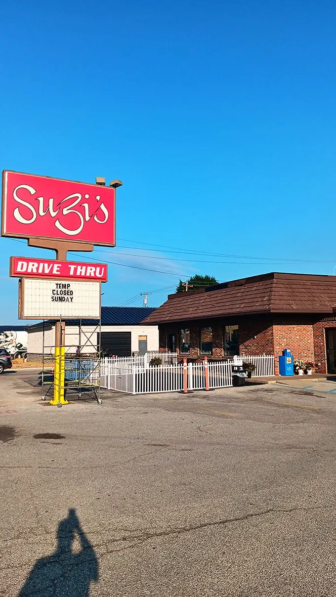 A beacon of comfort food hope! Suzi's red sign shines like a lighthouse, guiding hungry souls to a harbor of heavenly biscuits and gravy.
