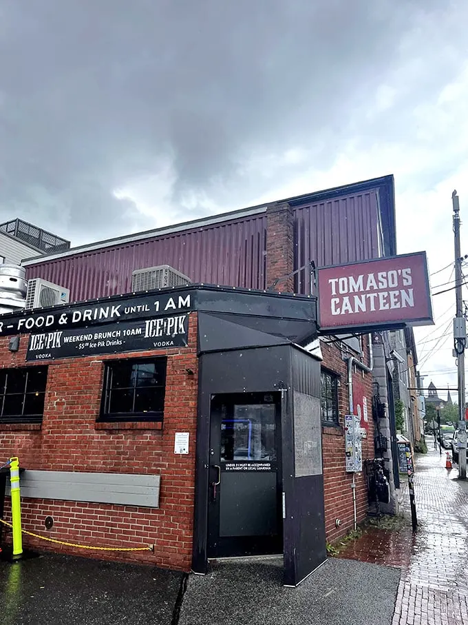 A brick facade that screams "hidden gem." Tomaso's Canteen: where culinary adventures begin and diet plans go to die.
