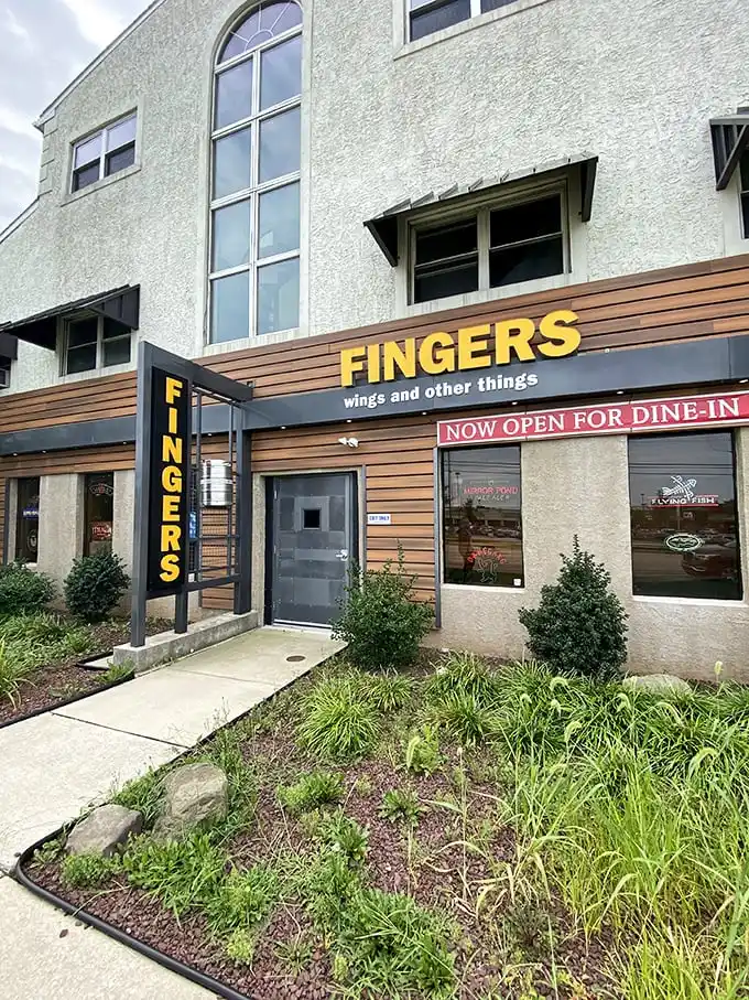 "Welcome to flavor town!" This unassuming exterior hides a world of wing-tastic delights, proving you can't judge a book by its cover – or a restaurant by its siding.