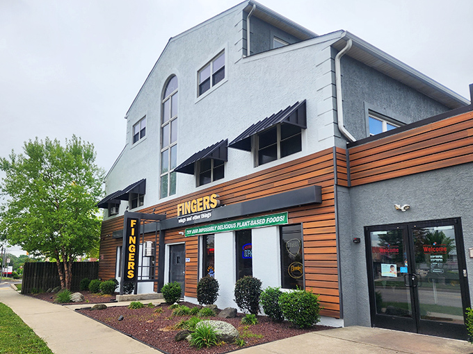 "Welcome to flavor town!" This unassuming exterior hides a world of wing-tastic delights, proving you can't judge a book by its cover – or a restaurant by its siding.