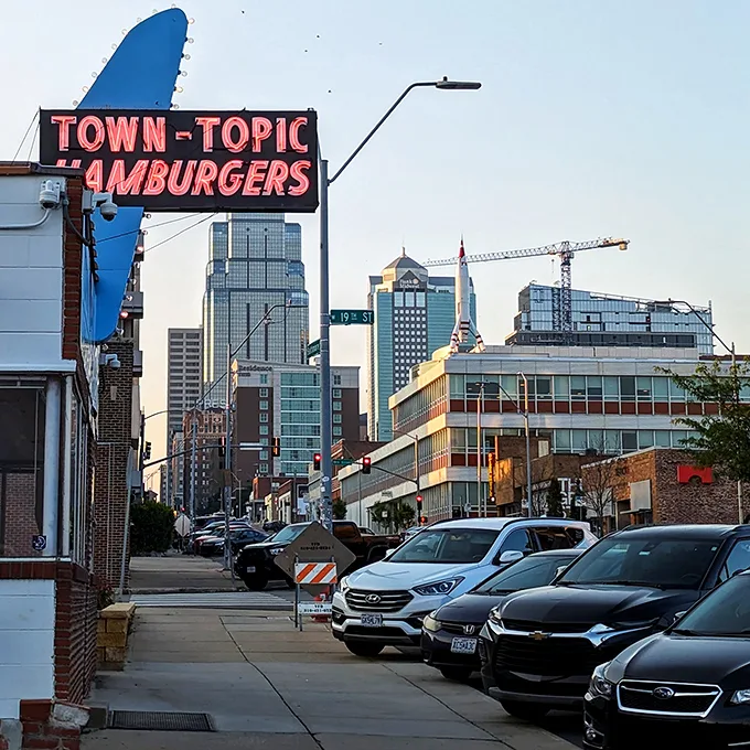 Step back in time! Town Topic's iconic sign beckons like a neon-lit lighthouse, guiding hungry souls to burger nirvana.