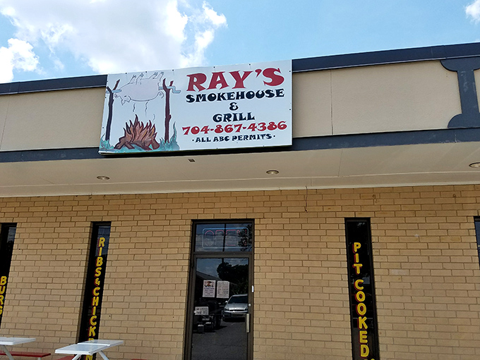 Welcome to burger paradise! This unassuming exterior hides a world of flavor, with that vintage green truck hinting at the old-school goodness waiting inside.