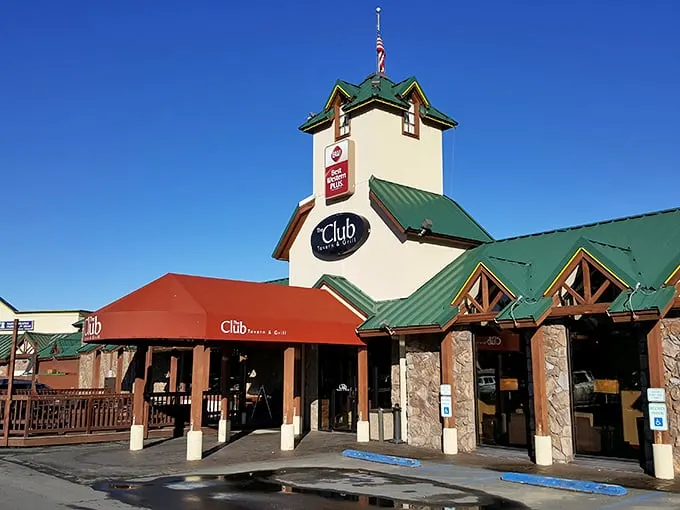A beacon of deliciousness! The Club Tavern and Grill stands tall, its yellow exterior and red awning beckoning hungry travelers like a culinary lighthouse in the heart of Bozeman.