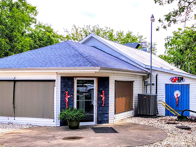 The unassuming white exterior with that iconic blue door is like a culinary TARDIS—modest on the outside, but containing breakfast universes within.