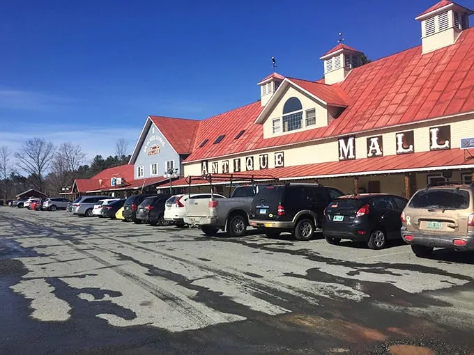 The iconic exterior of Vermont Antique Mall stands like a beacon of nostalgia against the Green Mountain backdrop, welcoming treasure hunters from near and far.