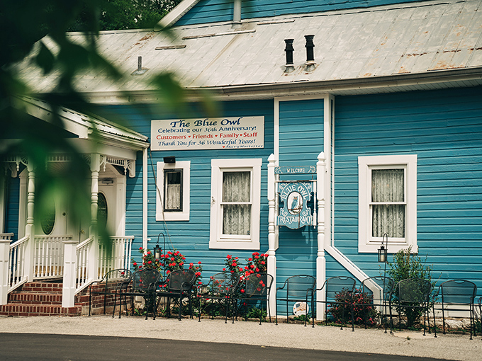 The storybook blue exterior with white trim beckons like a mirage in the Missouri countryside. No filter needed—this is pure small-town charm at its finest.