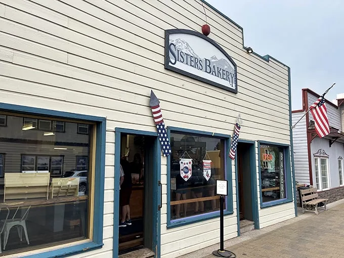 Welcome to carb heaven! Sisters Bakery's charming exterior is like a siren call to pastry lovers, complete with patriotic flair.