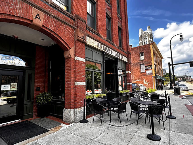The historic brick façade of Armsby Abbey stands as Worcester's culinary beacon, its green trim and weathered sign promising gastronomic treasures within.