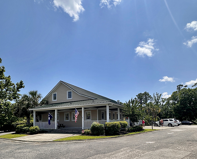 Home sweet smokehouse! This charming cottage-style exterior with its inviting porch says "grandma's cooking" before you even walk through the door.