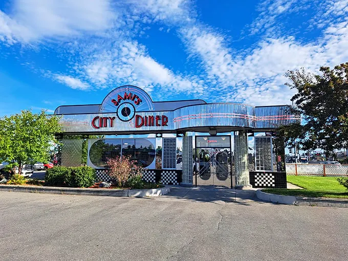 Step into a time machine disguised as a diner! Sami's City Diner's exterior promises a journey back to the fabulous '50s, complete with neon signs and retro charm.
