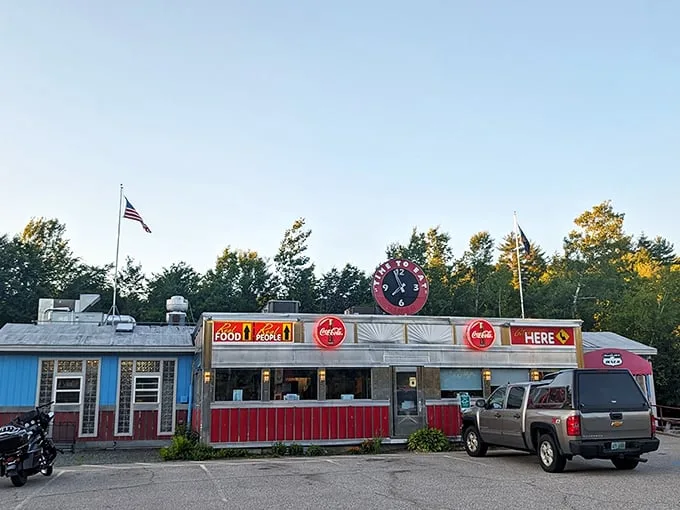 Step back in time! This retro diner's exterior is like a beacon calling all hungry time-travelers. Red, white, and chrome – the holy trinity of diner design.