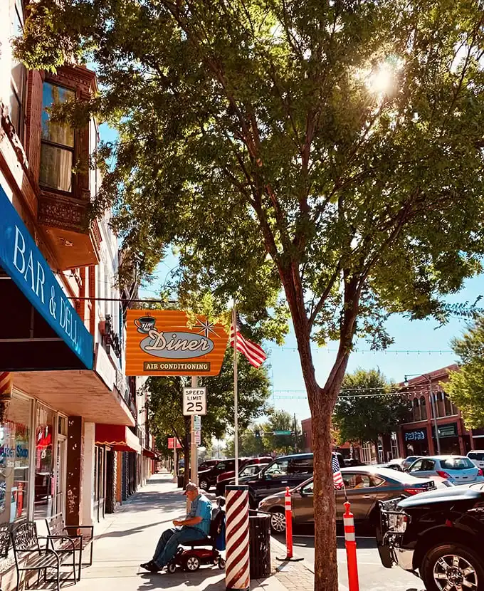 That iconic orange and teal sign doesn't just promise air conditioning—it's announcing your arrival at breakfast paradise on Main Street.