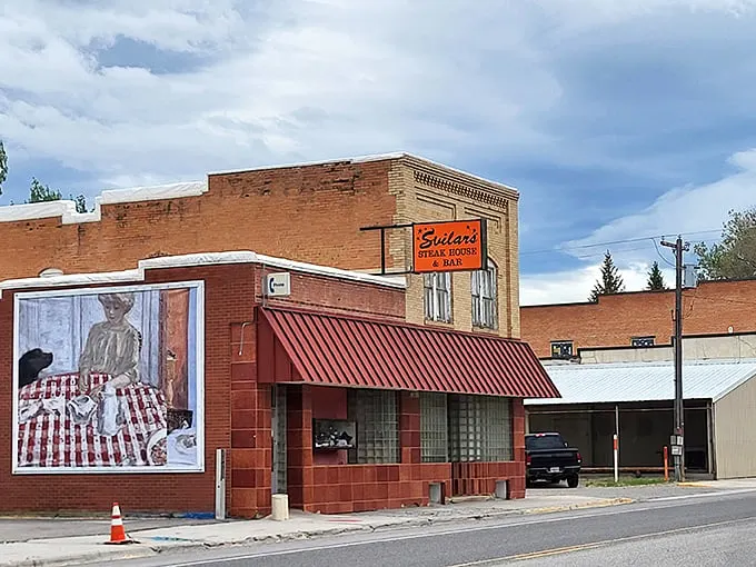 A red-brick beacon of culinary delight! Svilar's Steak House & Bar stands proud, its sign is a siren call to hungry travelers and locals alike.