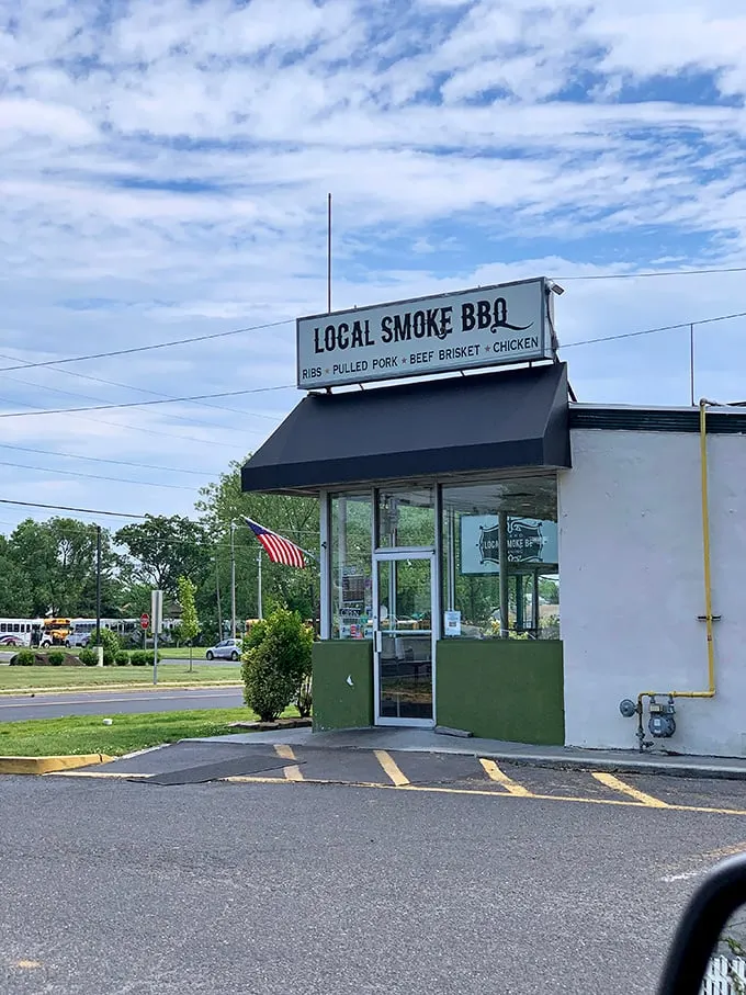 The unassuming storefront that hides barbecue greatness. Like finding a Picasso at a yard sale, this modest exterior conceals smoky treasures within.