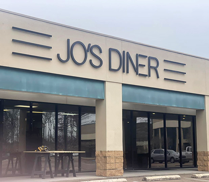 The classic facade of Jo's Diner in Flowood welcomes hungry patrons with its clean lines and retro signage—a beacon of breakfast bliss in Mississippi.