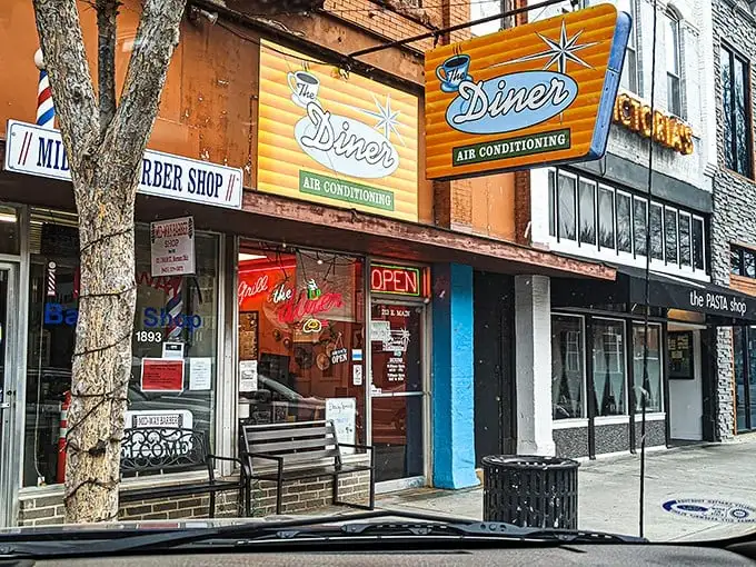 That iconic orange and teal sign doesn't just promise air conditioning—it's announcing your arrival at breakfast paradise on Main Street.
