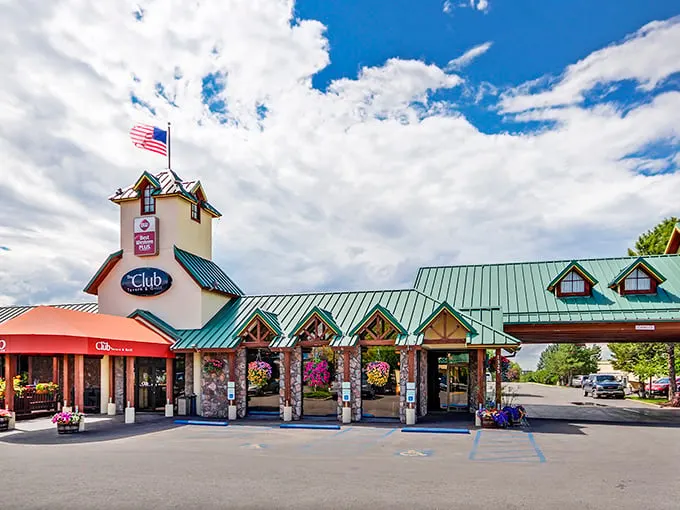 A beacon of deliciousness! The Club Tavern and Grill stands tall, its yellow exterior and red awning beckoning hungry travelers like a culinary lighthouse in the heart of Bozeman.