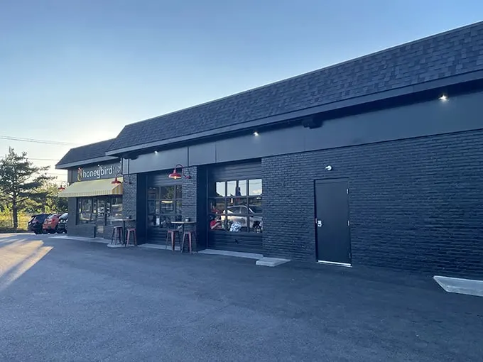 Honeybird's sleek black brick exterior stands like a beacon for fried chicken pilgrims. Simplicity outside, magic inside.