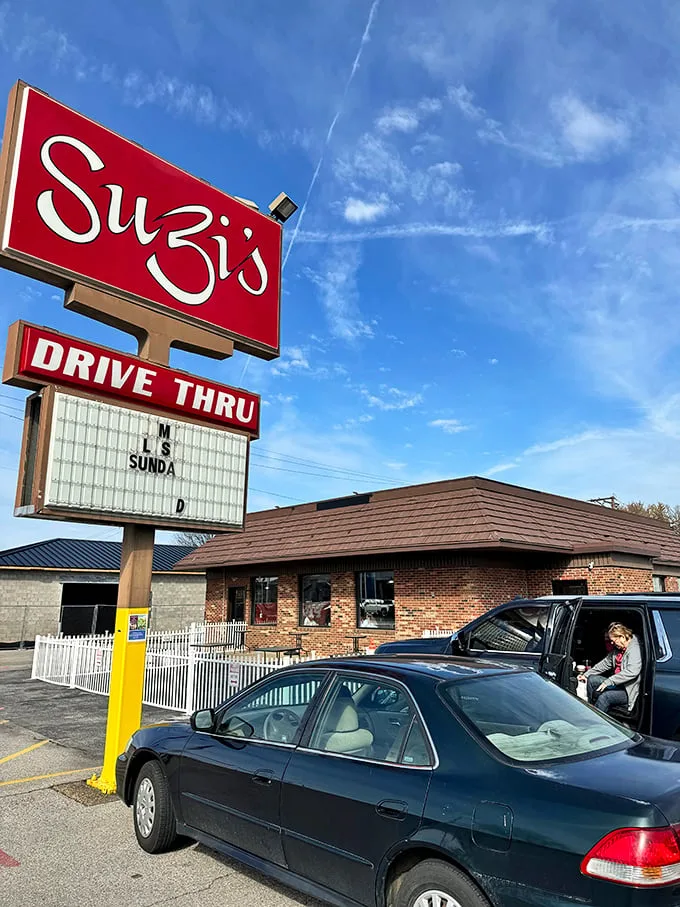 A beacon of comfort food hope! Suzi's red sign shines like a lighthouse, guiding hungry souls to a harbor of heavenly biscuits and gravy.