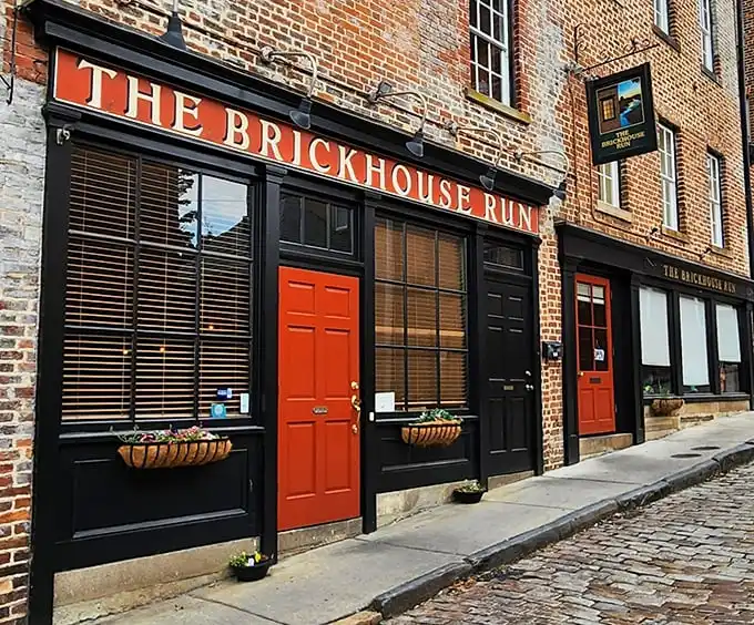 Historic charm meets culinary magic where those bright red doors practically shout, "Come in, the cobblestones have been waiting for you!"