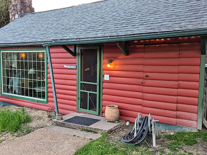 Rustic charm meets culinary delight! This log cabin's red exterior isn't just for show—it's a beacon for hungry travelers seeking a taste of the Ozarks.