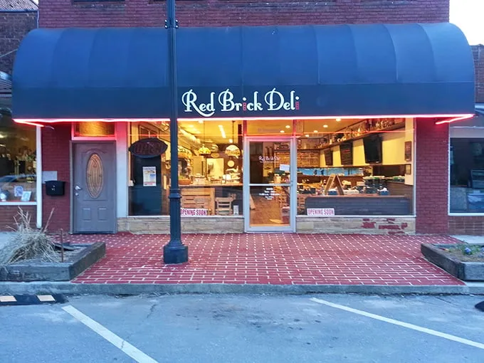 A blue awning announces culinary paradise at Red Brick Deli, where sandwich dreams become delicious reality in downtown Murphy.