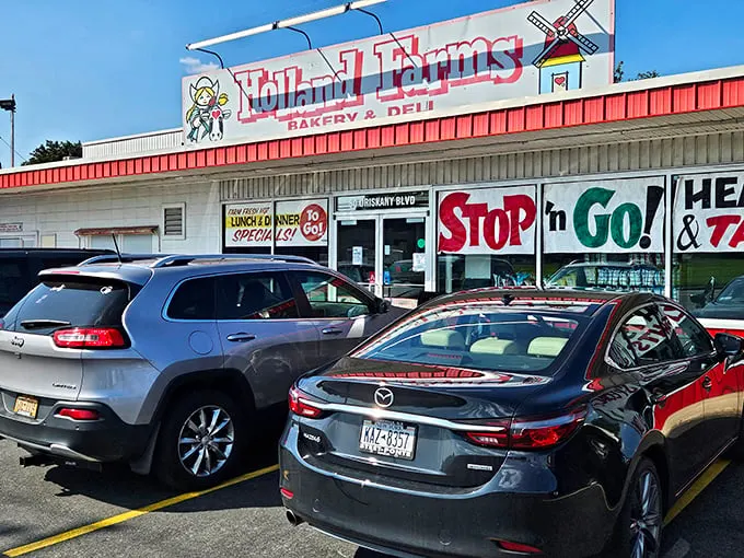 Welcome to carb heaven! Holland Farms' iconic storefront beckons with promises of sugary delights and deli dreams. It's like Willy Wonka opened a bakery in small-town America.