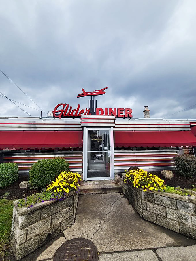 Welcome to the Glider Diner, where nostalgia meets neon! This retro gem's exterior is like a time machine with a side of fries.