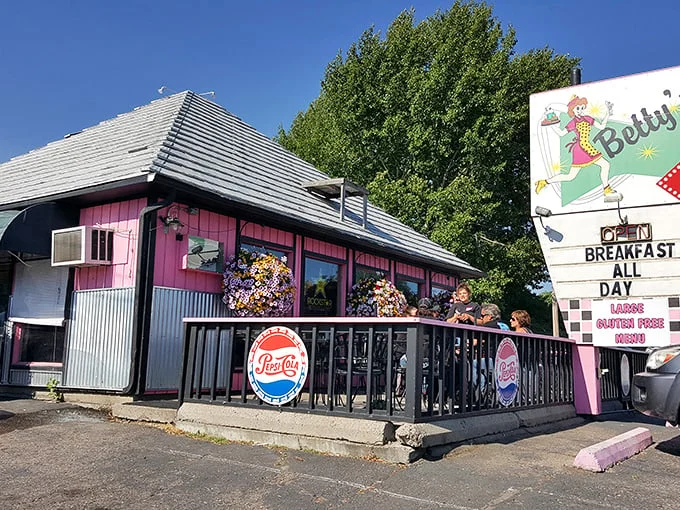 Step back in time! Betty's Diner's retro exterior, complete with a sassy cartoon waitress, promises a trip down memory lane and some seriously good eats.