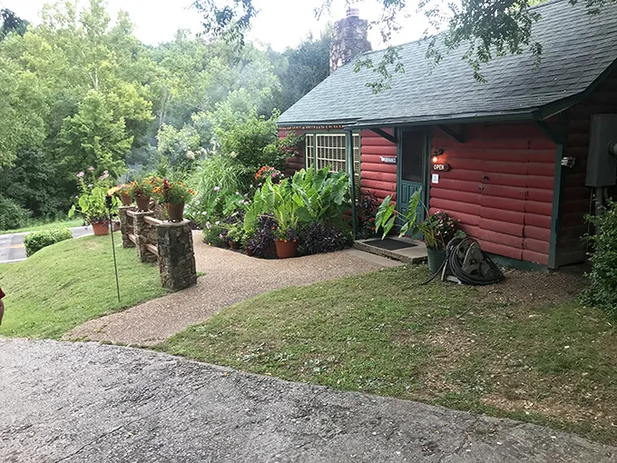 Rustic charm meets culinary delight! This log cabin's red exterior isn't just for show—it's a beacon for hungry travelers seeking a taste of the Ozarks.
