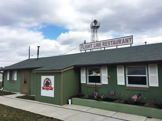 "Flight Line Restaurant: Where breakfast dreams take off!" This charming green building houses a culinary cockpit that'll make your taste buds soar.