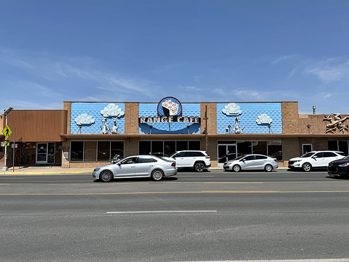 Holy cow! This café's façade is like a whimsical New Mexican postcard come to life. Those cloud-peeking bovines are udderly delightful!