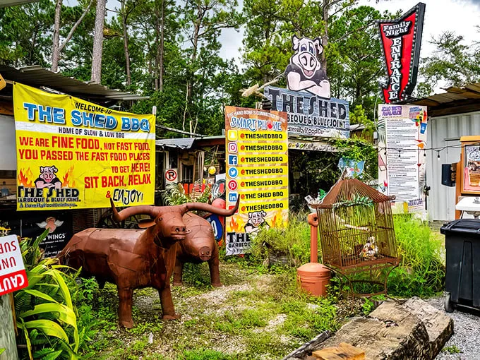 Welcome to barbecue wonderland! The Shed's exterior is a delightful mishmash of signs, statues, and Southern charm that'll make you grin before you even step inside.