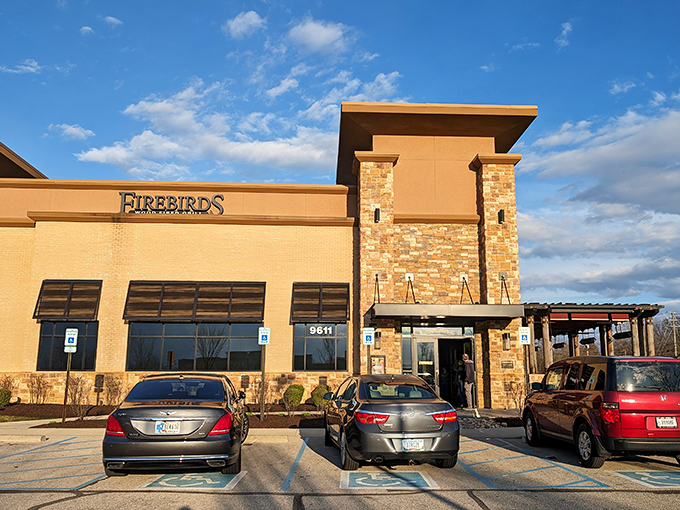 Welcome to Firebirds, where rustic charm meets culinary flair! This exterior promises a feast for the senses, with those rugged wooden pillars practically begging you to come inside.