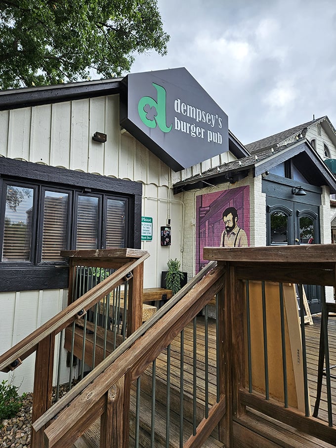 Welcome to burger paradise! Dempsey's exterior promises a feast for the senses, with its charming wooden deck and intriguing mural hinting at the culinary adventures within.
