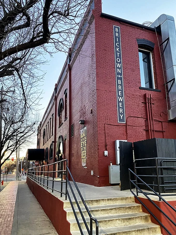 The iconic red brick exterior of Bricktown Brewery welcomes visitors. History and hops unite under one distinctive awning.